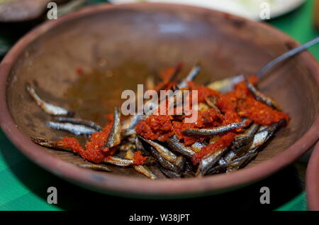Balado ikan depik, fried anchovies with spicy sauce Stock Photo - Alamy