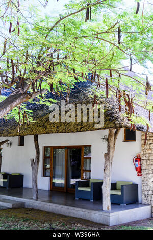 Thatched safari lodges in Namibia Stock Photo - Alamy