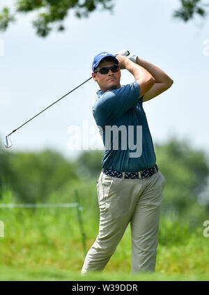 Adam Schenk tees off on the sixth hole during the final round of the ...