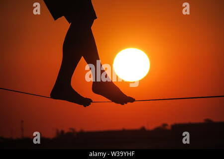 Balanced on the tightrope at sunset in Melbourne Australia Stock Photo ...