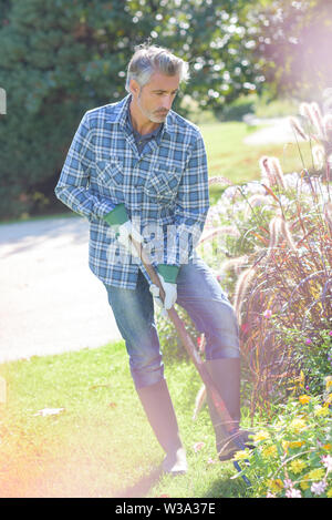 Human hands with shovel digging garden bed or farm. Farming, gardening ...