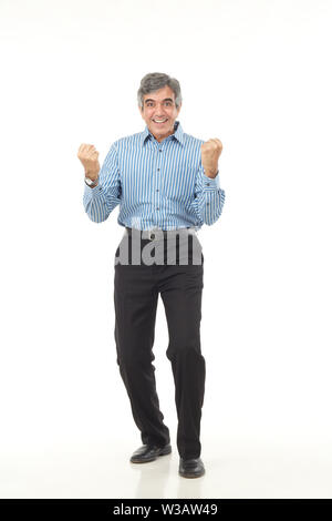 Portrait of mature man punching air Stock Photo - Alamy