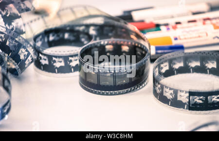 Filmstrip or film reel on a cutting table, vintage film production in ...