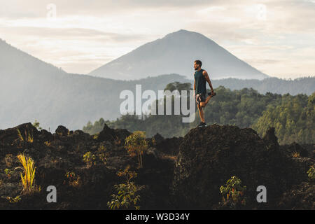 man doing sports and stretching leg outdoors Stock Photo - Alamy