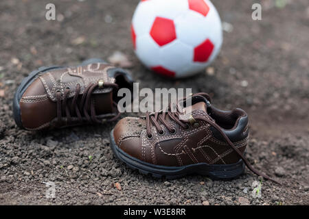 A pair of lost shoes. Missing kid or lost child concept Stock Photo - Alamy