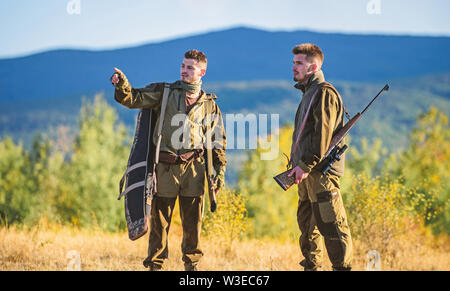 Gamekeepers walk mountains background. Gamekeepers sunny fall day ...