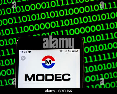 In this photo illustration the MODEC, Inc. logo is seen displayed on a ...