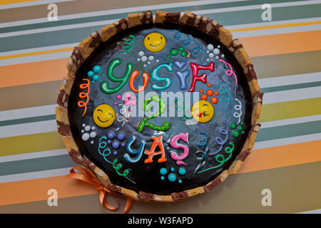 Black cake 2 year old Yusuf writing. Chocolate cake with black glaze ...