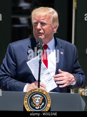 President Donald J. Trump puts on a flight jacket during a Troop Stock ...