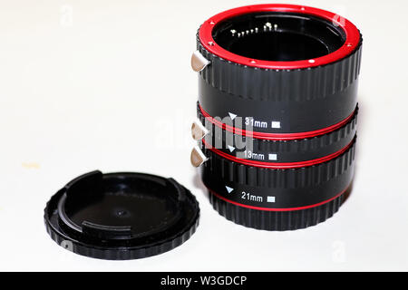 Macro photography camera lens extension tubes in white background Stock ...