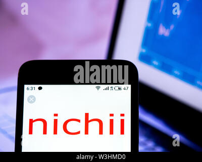 In this photo illustration the Nichii Gakkan logo is seen displayed on ...
