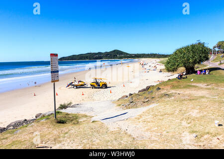 Byron Bay, Australia - 14th May 2015: People walking past and sitting ...