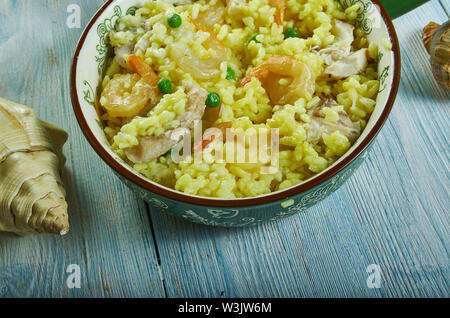 Paella with cod and shrimp, classic Spanish rice dish Stock Photo - Alamy
