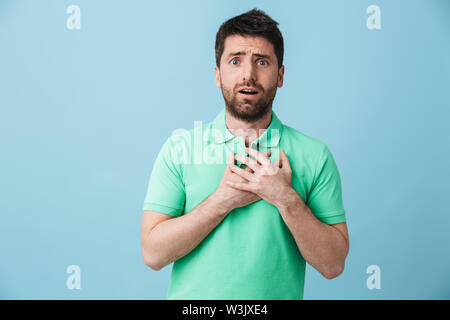 Image of scared confused young handsome bearded man posing isolated ...