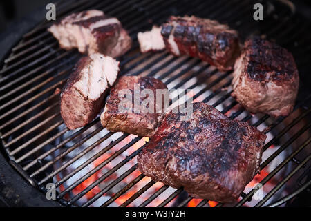 Roast beef at barbecue. Low temperature grilling barbecue Stock Photo ...