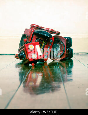 robot wars red robot defeated on old wooden floor Stock Photo - Alamy