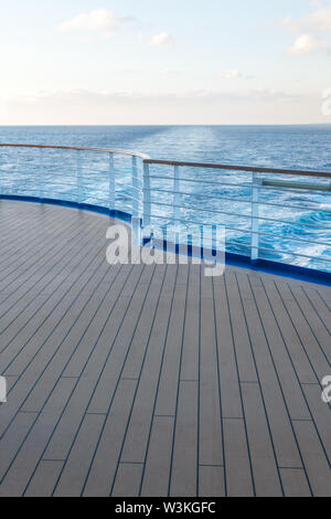 empty cruise ship deck with beach chairs and lamps at night time Stock ...