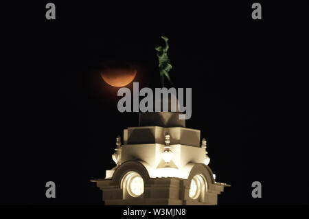 A partial lunar eclipse above the city Arnhem in the Netherlands on ...