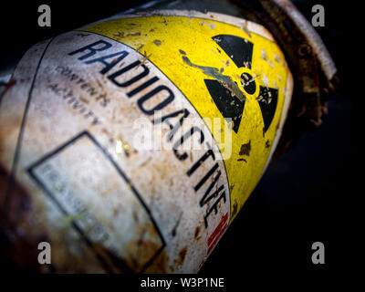 Radiation warning sign on transport index label stick on the rust and ...