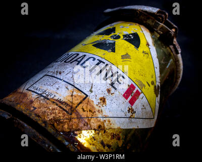 Radiation warning sign on transport index label stick on the rust and ...