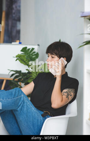 young pretty modern hipster business man with beard standing on black ...