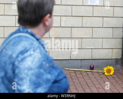 People walks past of a pro-Ukraine art deco in Warsaw, Poland, on March ...