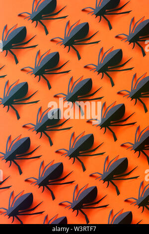Halloween holiday concept. haunted village over orange background. Top ...