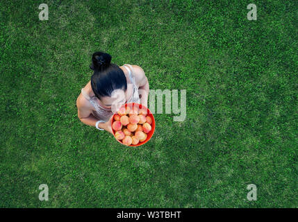 Woman holding tray with tasty apricot pie on wooden background Stock ...