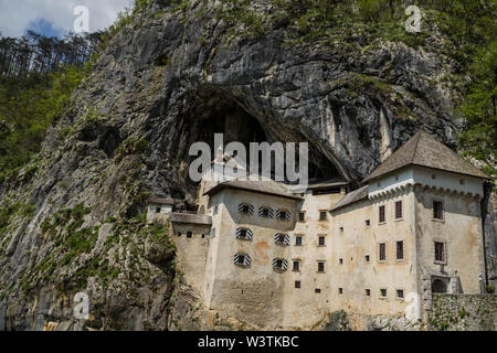 Castle of Predjama (Castel Lueghi), built inside a rocky mountain Stock ...