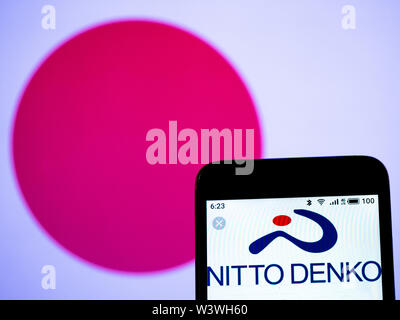 In this photo illustration, the Nitto Denko company logo is seen ...