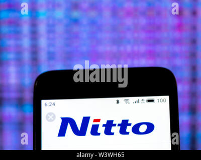 In this photo illustration, the Nitto Denko company logo is seen ...