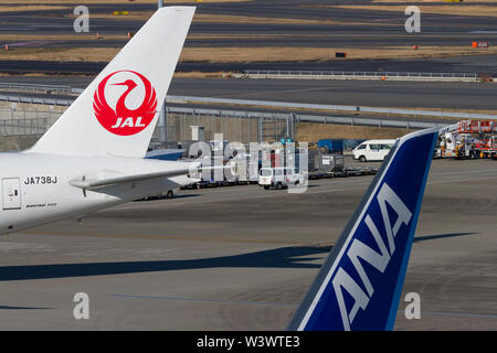 The tail planes of two Japan Airlines (JAL) passenger jets with the ...