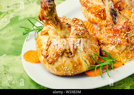 A grill with chicken legs wrapped in bacon Stock Photo - Alamy