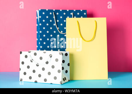 Color paper bags on multicolor background, space for text Stock Photo ...
