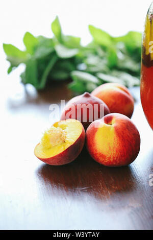 fresh juicy cut peach on steel plate Stock Photo - Alamy