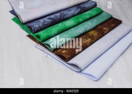 Multi-colored fabric cuts, folded overlap. Fabrics for sewing on a ...