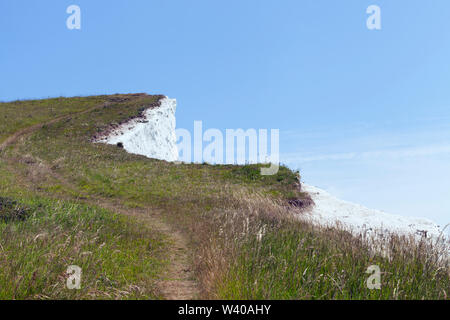 Coastal walking path on top of white chalk cliffs, overlooking the ...