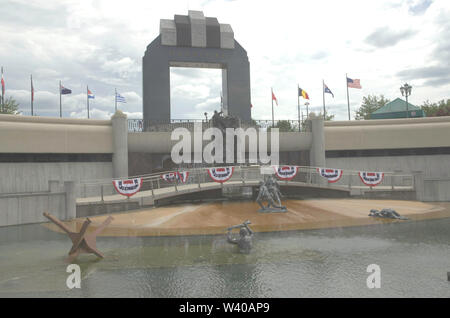 Statues of soldiers invading during D-Day are depicted at the Memorial ...