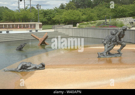 Statues of soldiers invading during D-Day are depicted at the Memorial ...