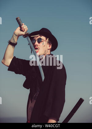 Defense, power, honor, force. Samurai with japan katana weapon outdoors ...