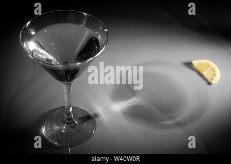 A glass of daiquiri and lemon casts a shadow Stock Photo - Alamy