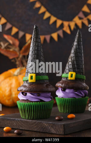 Sweets for halloween party. Funny homemade Halloween cupcakes on modern ...