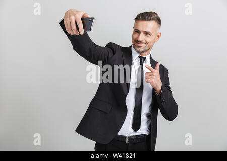 caucasian director pointing finger on smile in studio. director ...