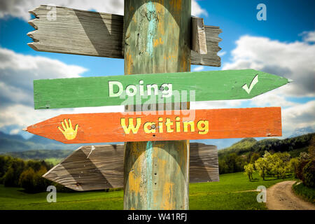 Street Sign the Direction Way to Doing versus Waiting Stock Photo - Alamy