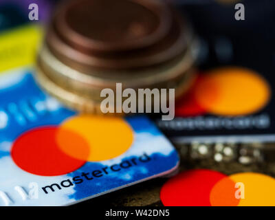 Macro of Mastercard bank cards and coins Stock Photo - Alamy
