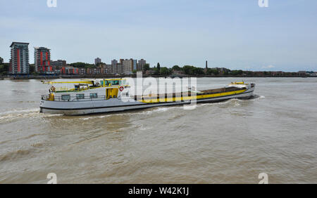 The general cargo ship, Polla Rose steams upriver on the River Thames ...