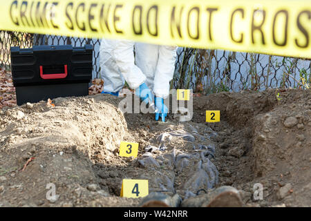 Forensic science specialist at work, collecting evidence at the ...