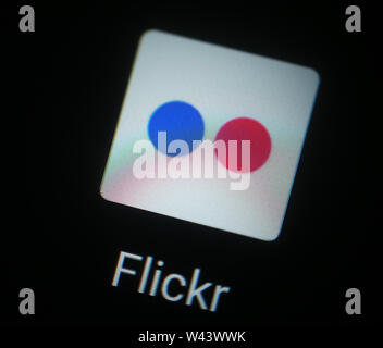 Using Flickr on a mobile phone Stock Photo - Alamy