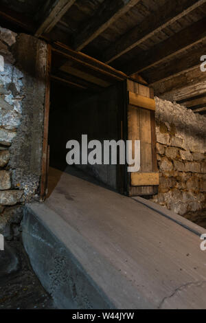 Old concrete loading chute in warehouse basement Stock Photo - Alamy