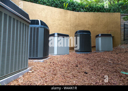 Multiple Air Conditioner Compressors next to large house or building ...